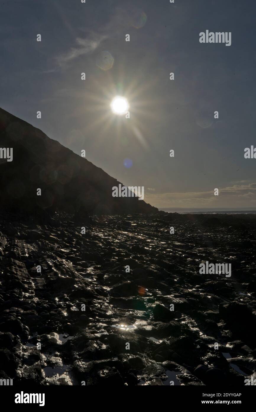 Beach by cliff coastal path with pebbles,rocks and unique stacked ...