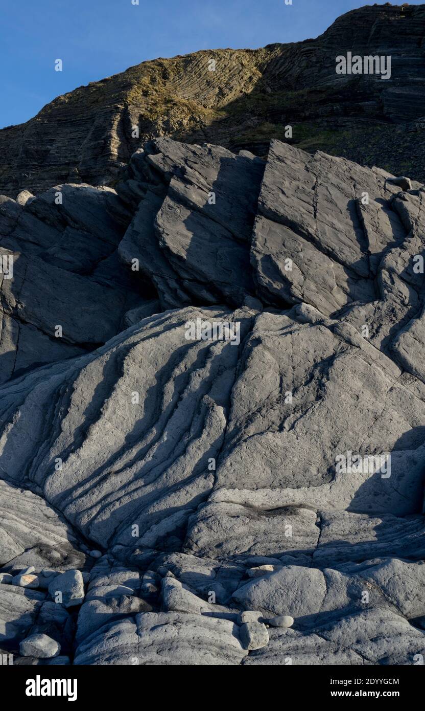 Beach by cliff coastal path with pebbles,rocks and unique stacked ...