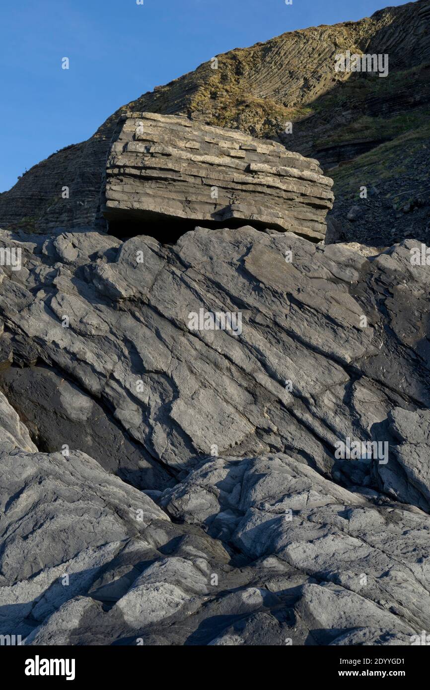 Beach by cliff coastal path with pebbles,rocks and unique stacked ...