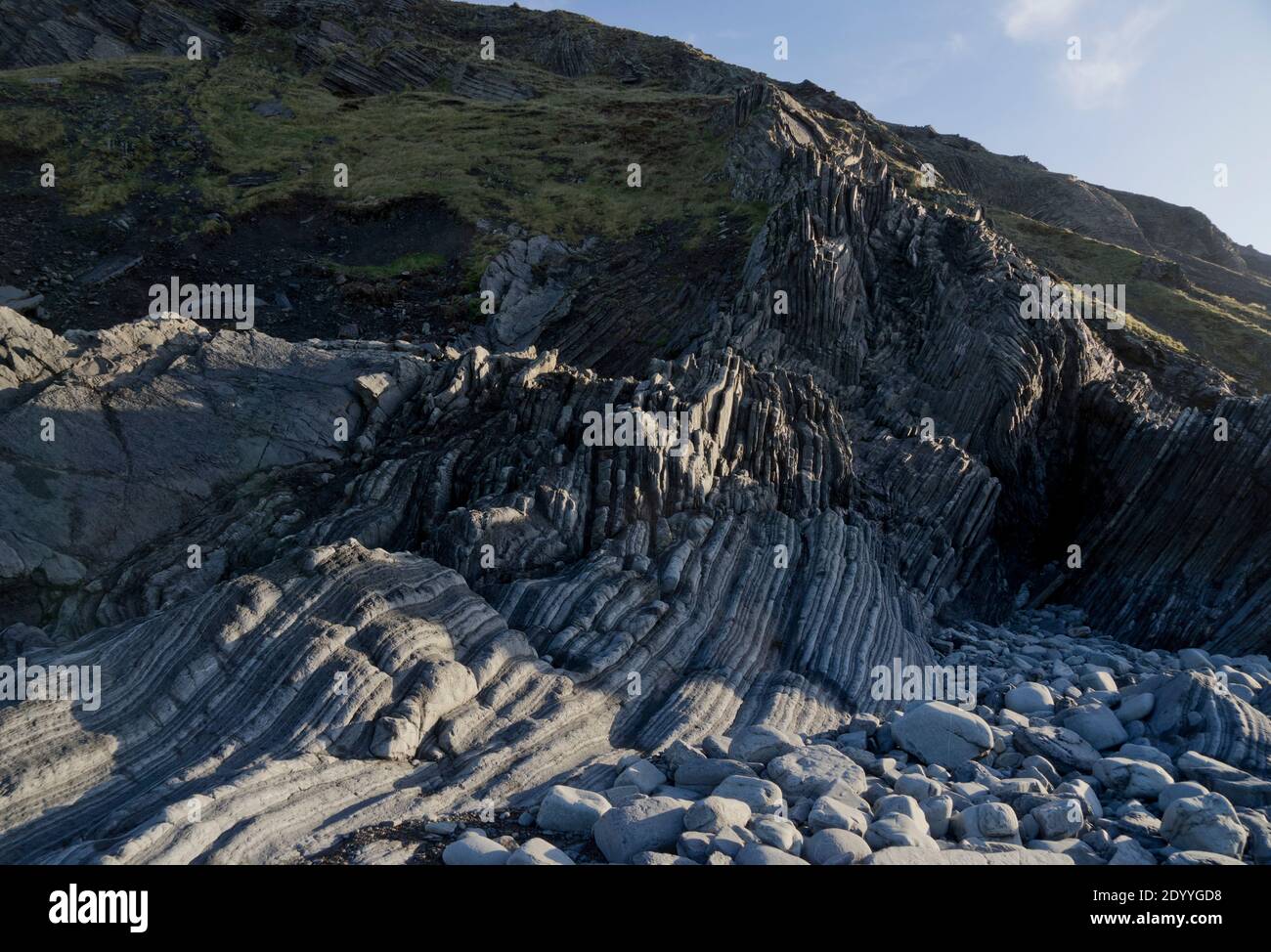 Beach by cliff coastal path with pebbles,rocks and unique stacked ...