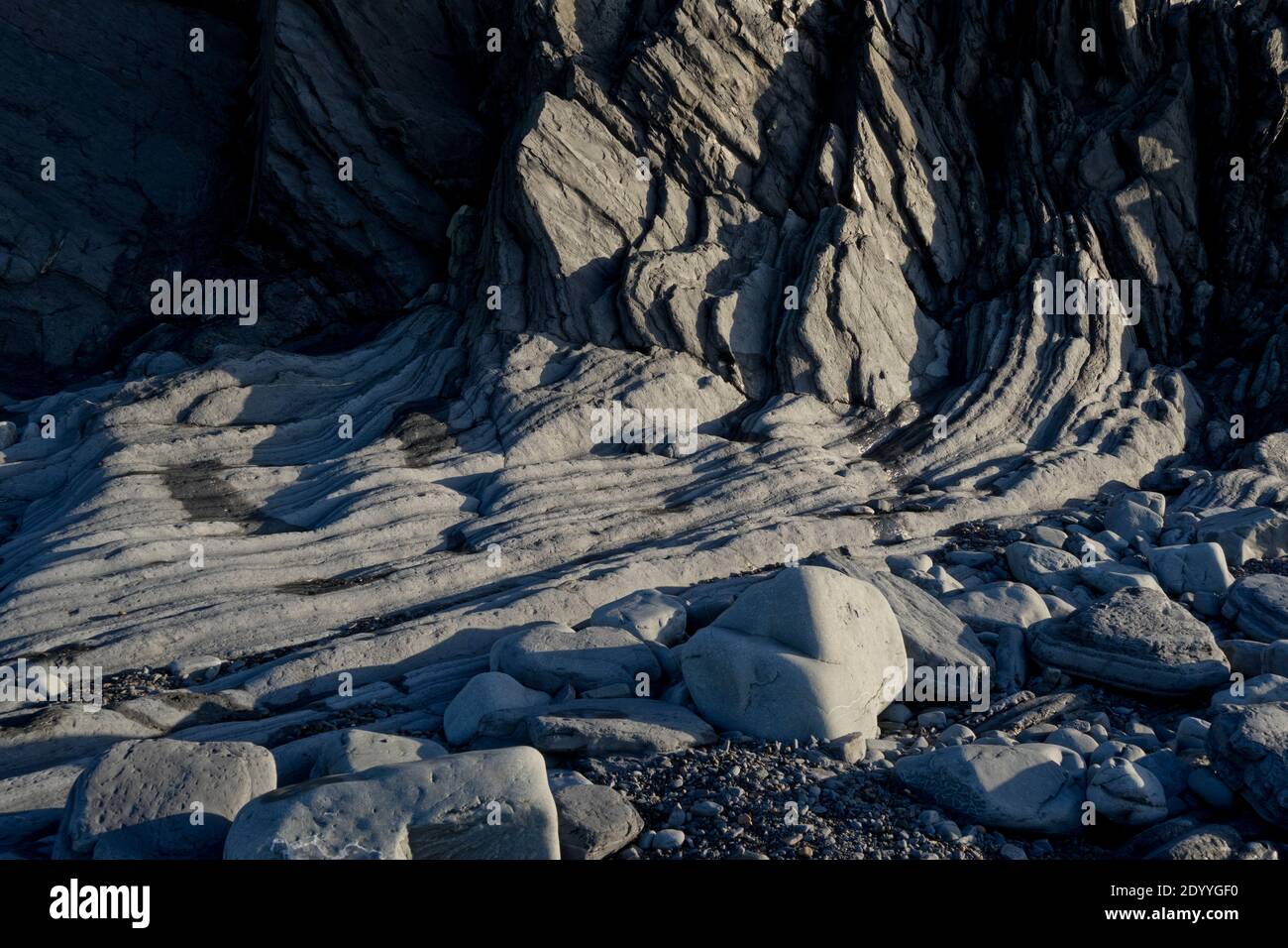 Beach by cliff coastal path with pebbles,rocks and unique stacked ...