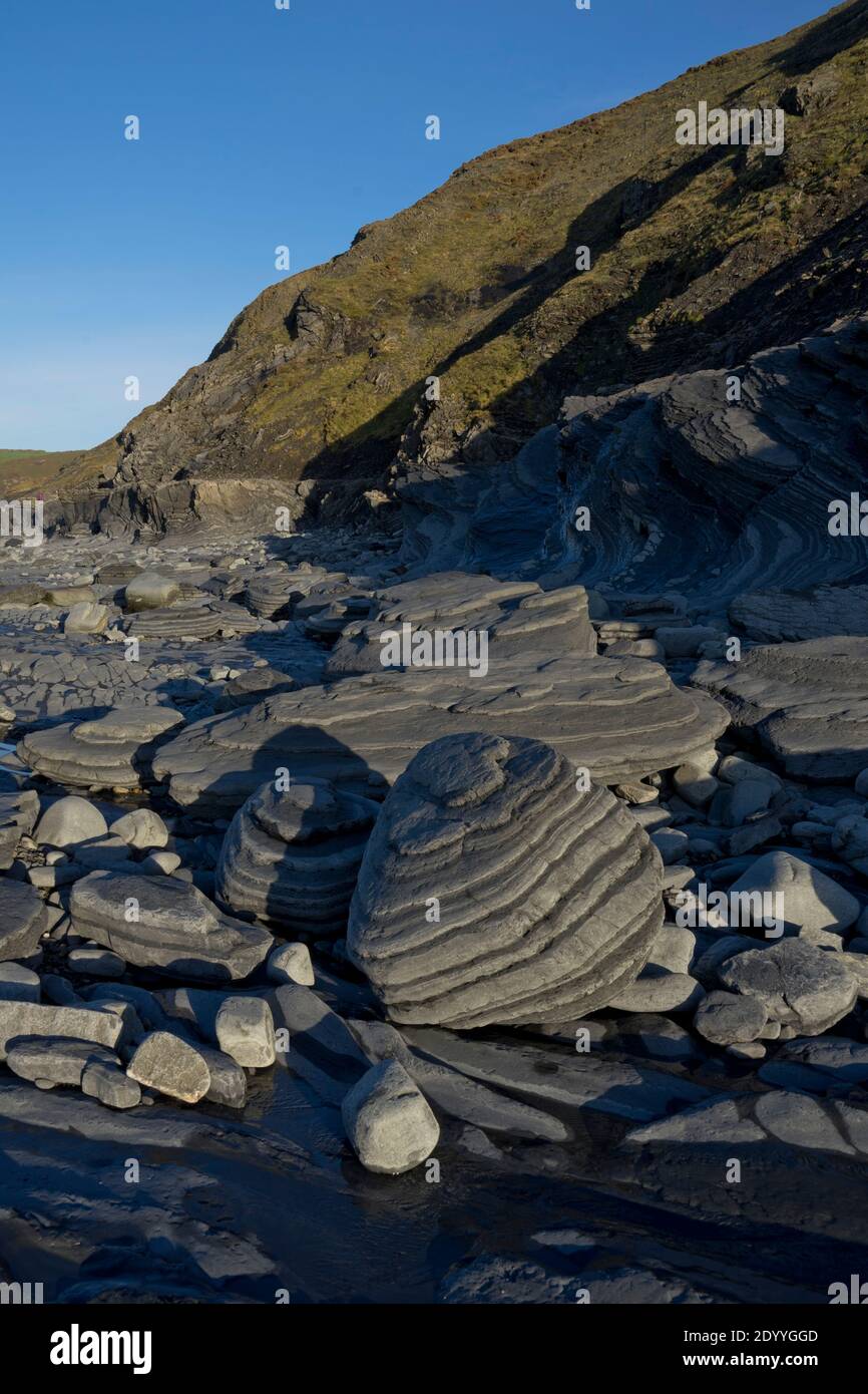 Beach by cliff coastal path with pebbles,rocks and unique stacked ...