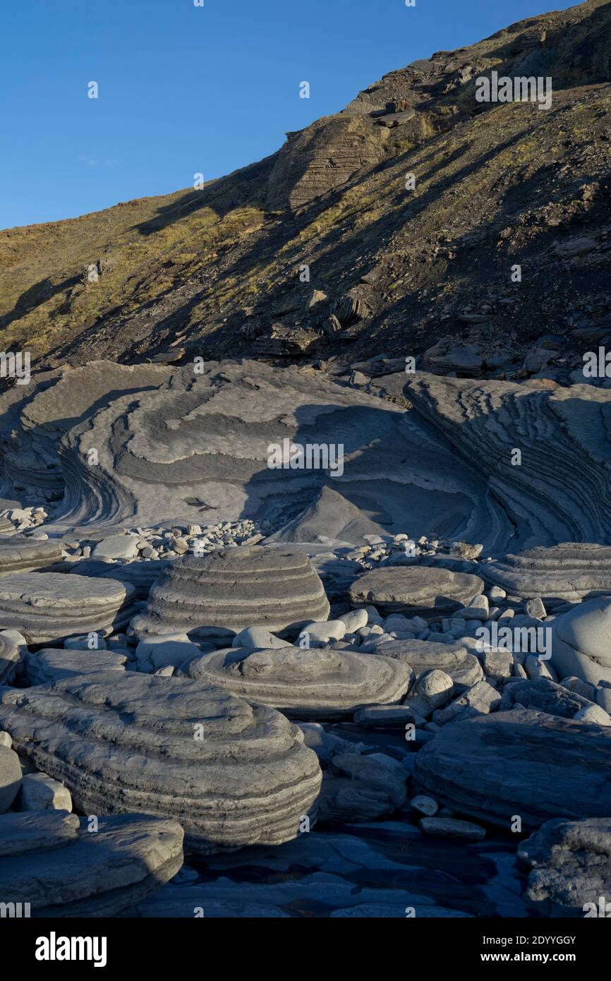 Beach by cliff coastal path with pebbles,rocks and unique stacked ...