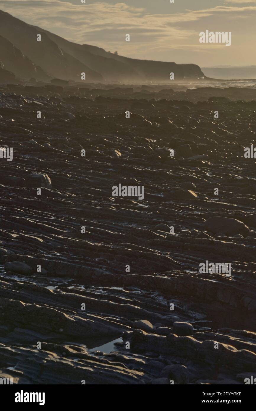 Beach by cliff coastal path with pebbles,rocks and unique stacked ...