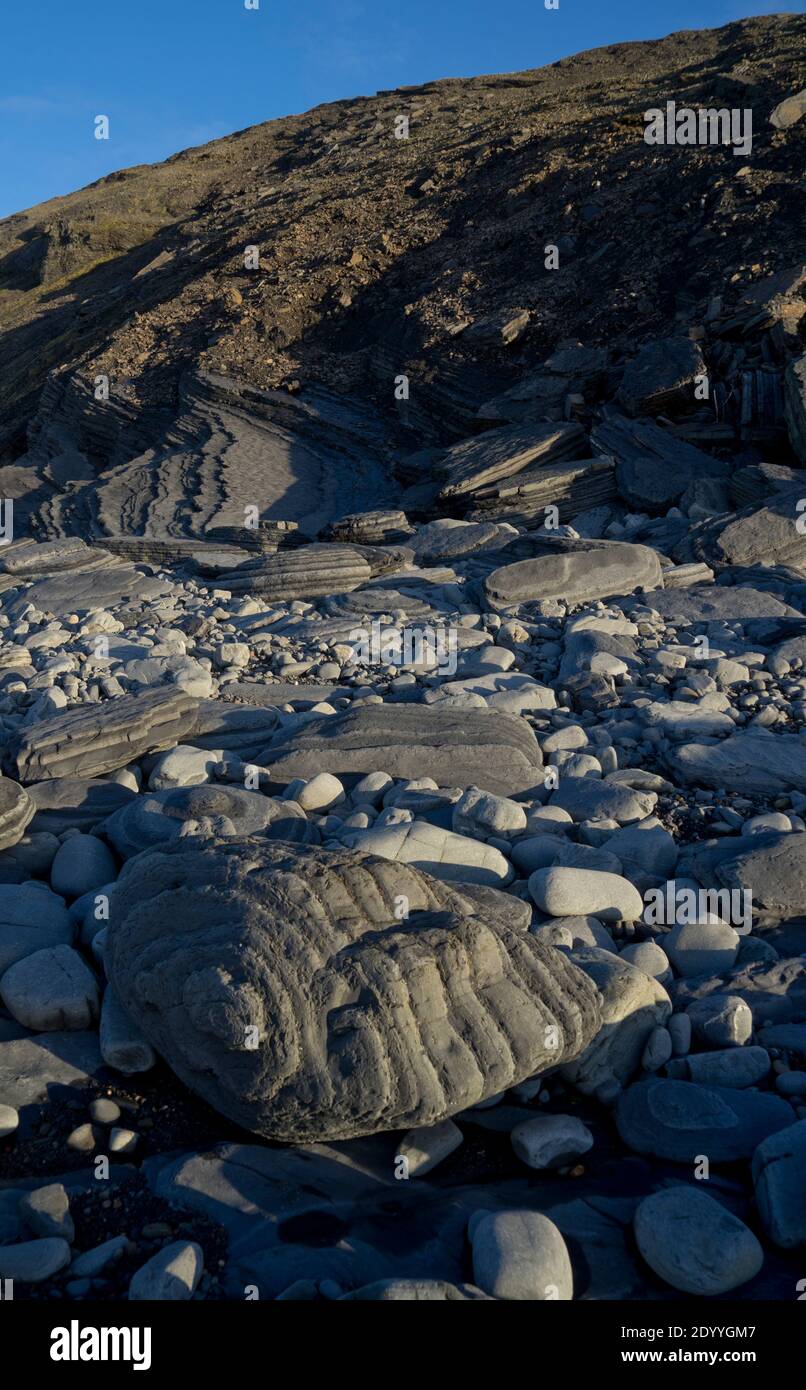 Beach by cliff coastal path with pebbles,rocks and unique stacked ...