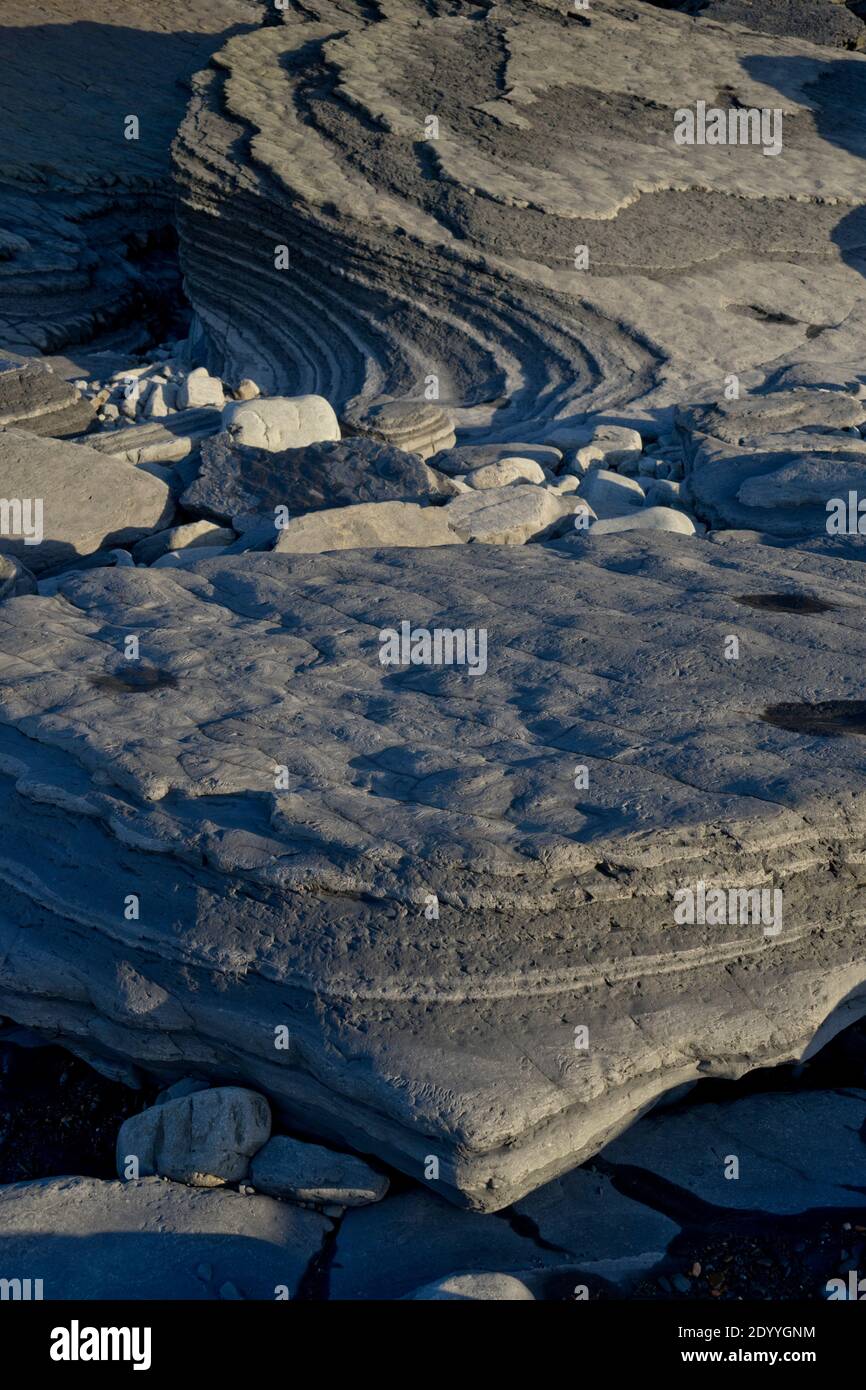 Beach by cliff coastal path with pebbles,rocks and unique stacked ...