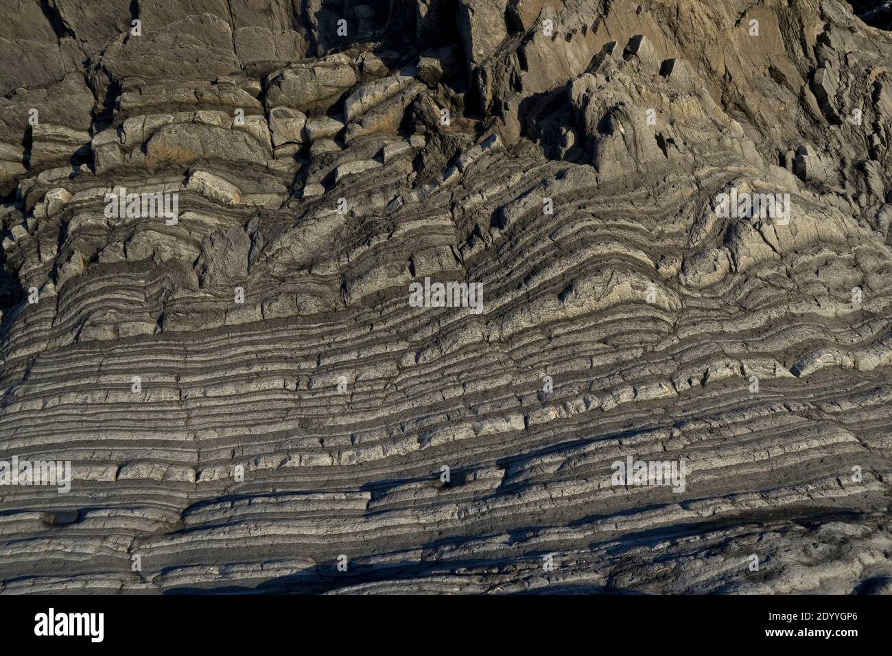 Beach by cliff coastal path with pebbles,rocks and unique stacked ...