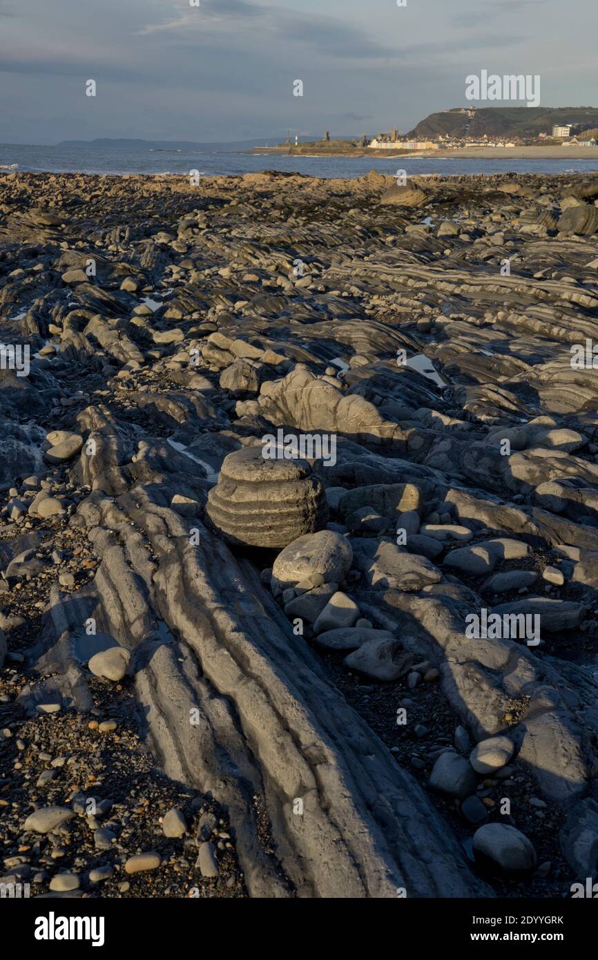 Beach by cliff coastal path with pebbles,rocks and unique stacked ...