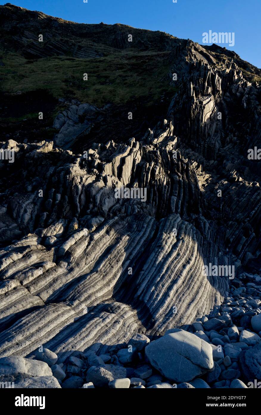 Beach by cliff coastal path with pebbles,rocks and unique stacked ...