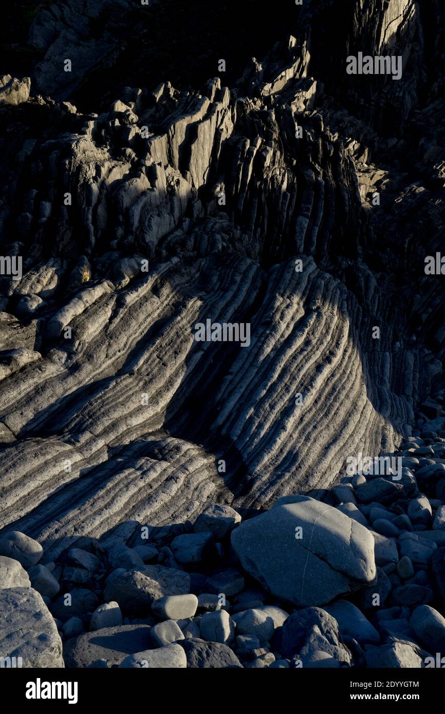 Beach by cliff coastal path with pebbles,rocks and unique stacked ...