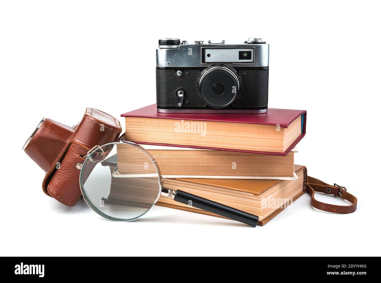 Books, camera and magnifying glass isolated on white background Stock ...