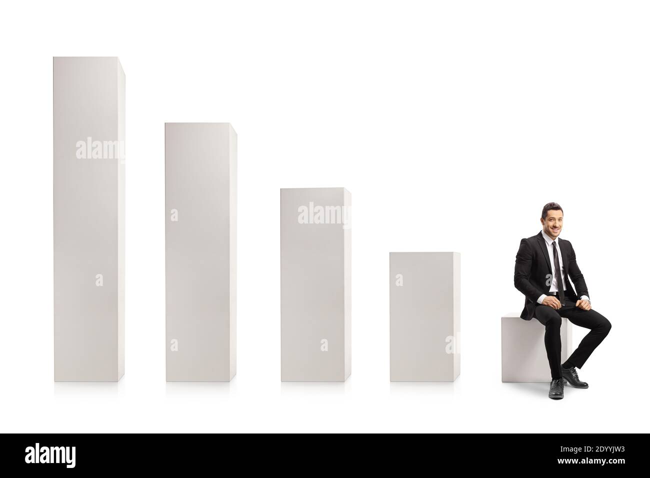 Businessman sitting on the shortest white column in a chart and smiling ...