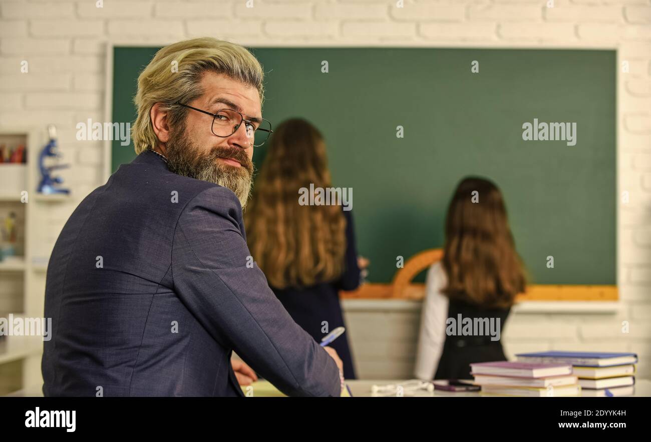 Watching them. Teacher and kids Classroom. Discussion group of children ...