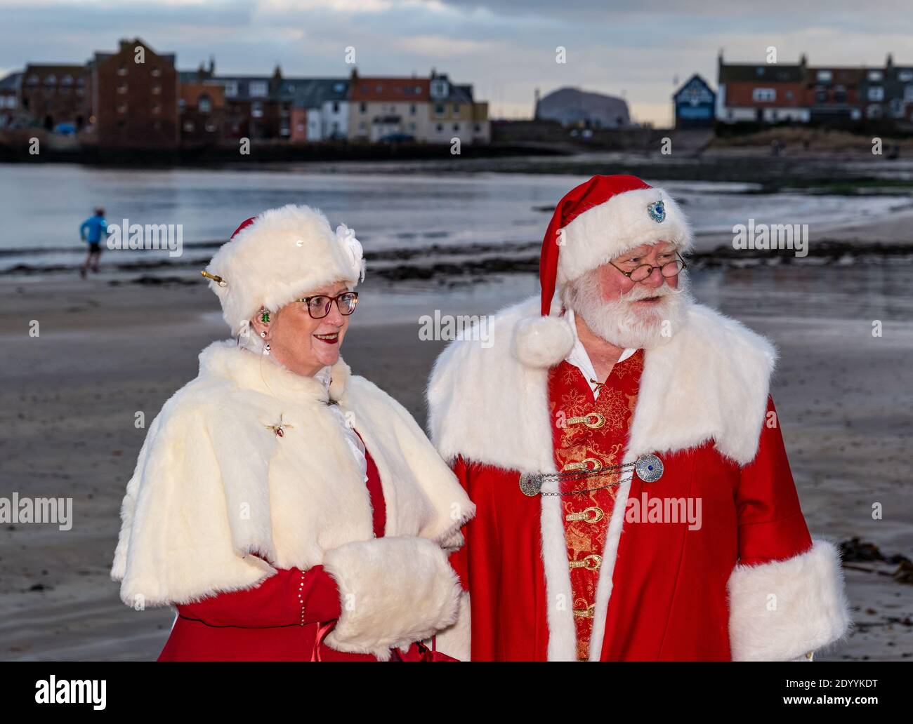 Couple dressed in Santa or Father Christmas and Mrs Claus costumes on ...