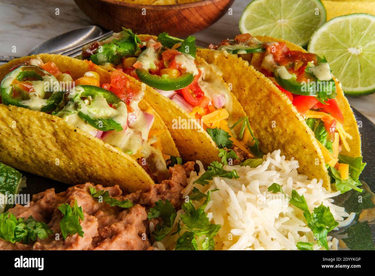 Mexican beef tacos with rice refried beans tortilla chips and various ...