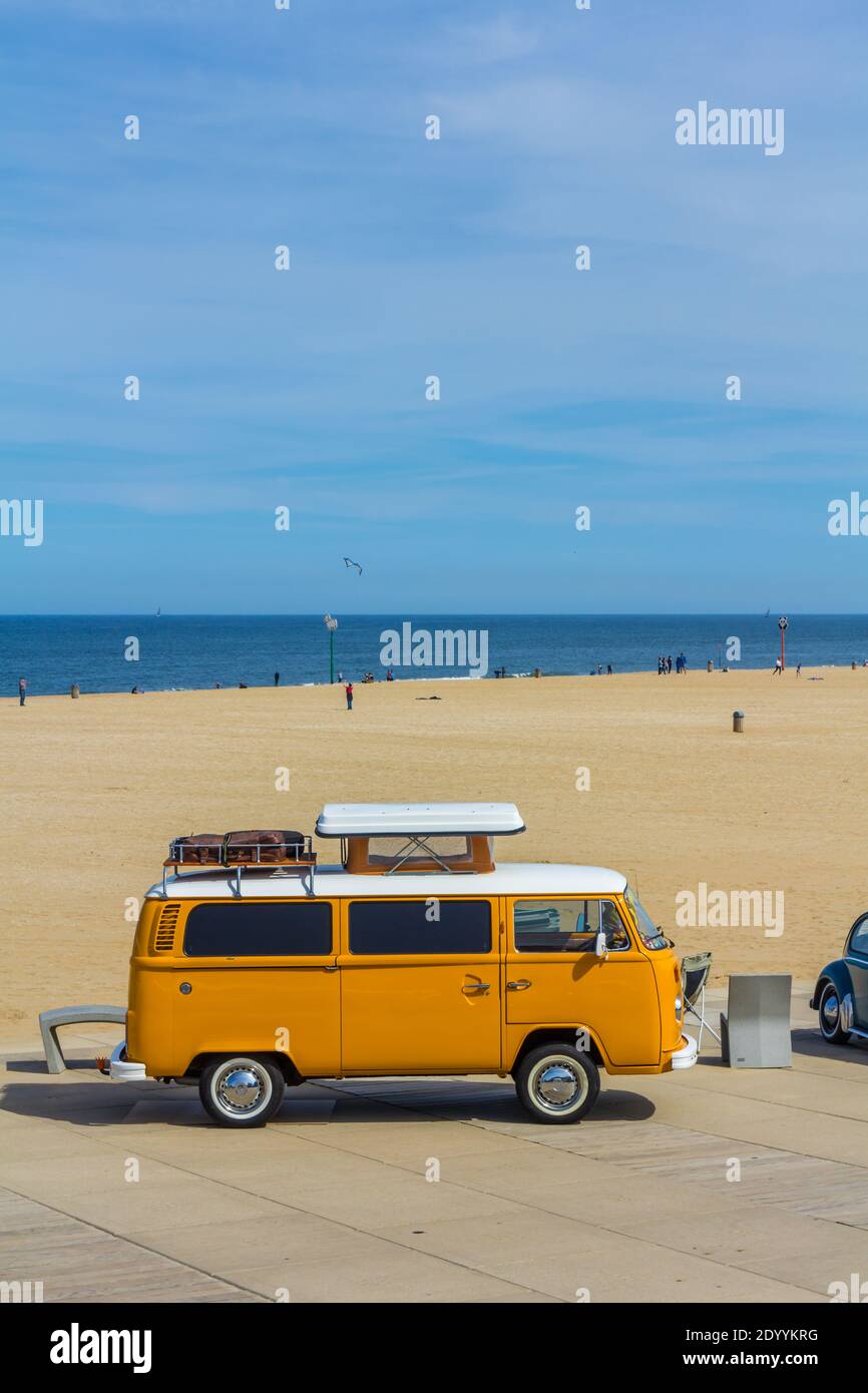 Scheveningen beach, the Netherlands - May 21, 2017: orange VW combi ...