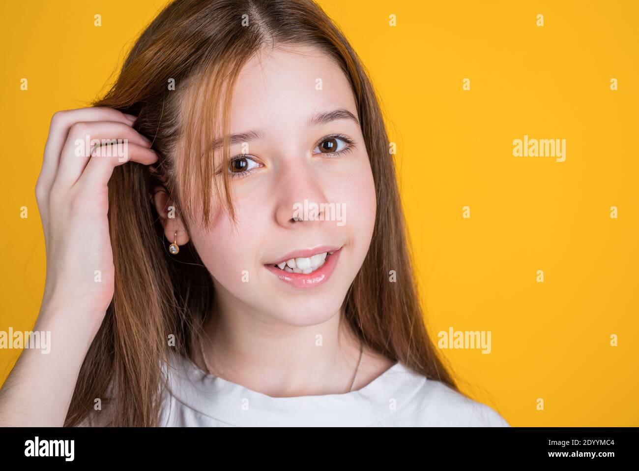 teen girl touch long hair has perfect tender skin, beauty Stock Photo ...