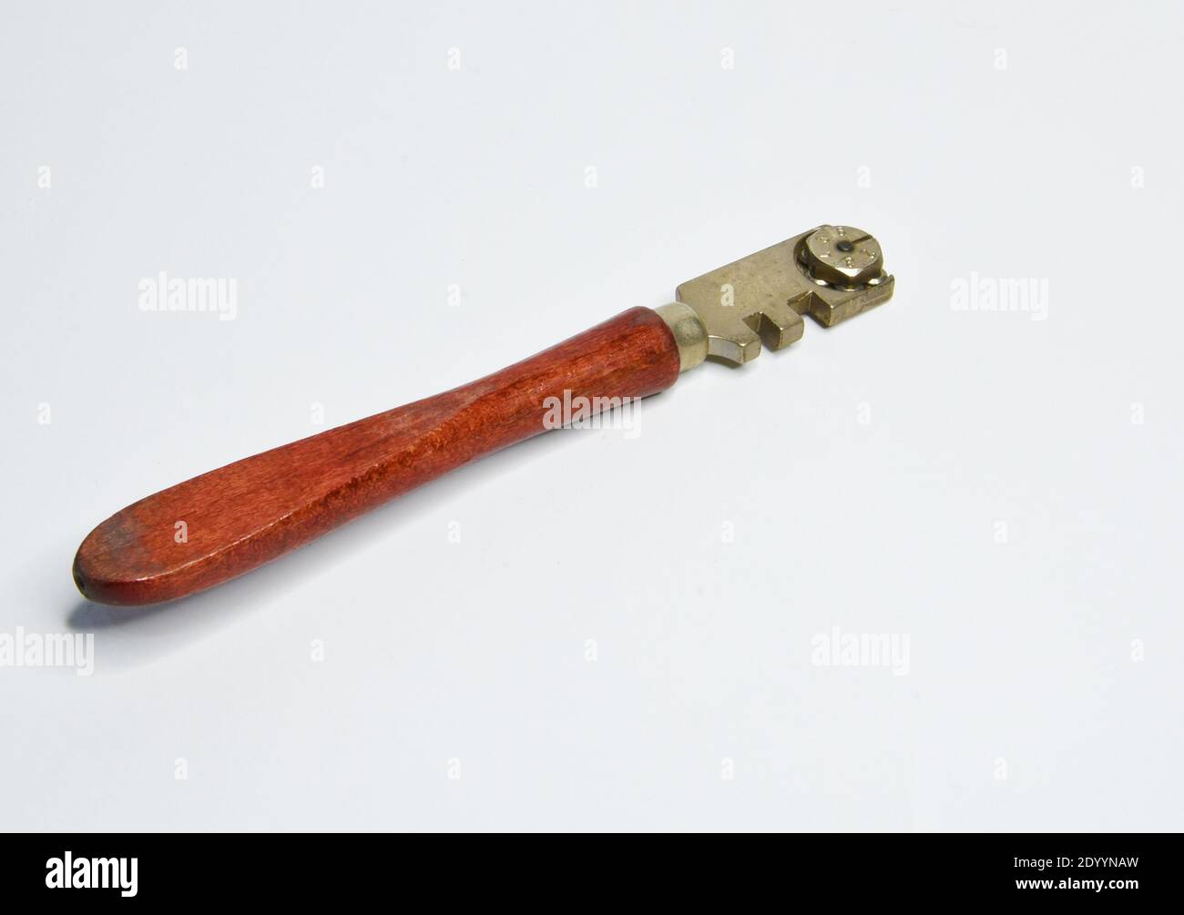 Glass cutter made of metal with wooden handle Stock Photo - Alamy