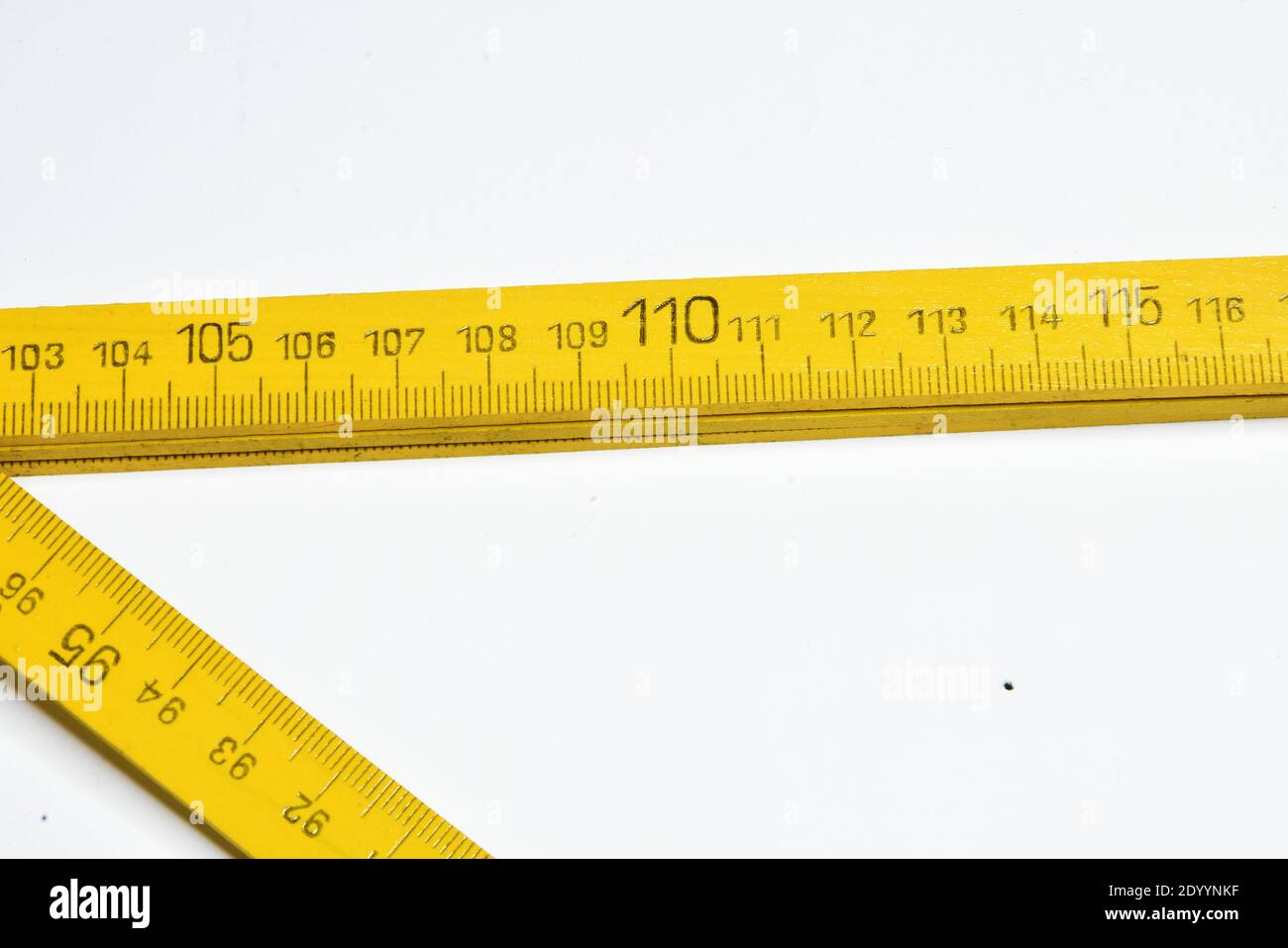 Vintage folding wooden tape measuring tool Stock Photo - Alamy