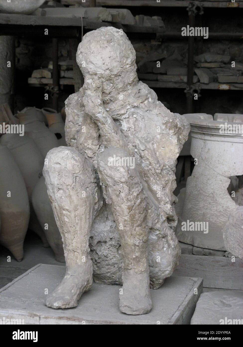 Cast of a seated victim from the eruption of Mount Vesuvius on Pompeii ...