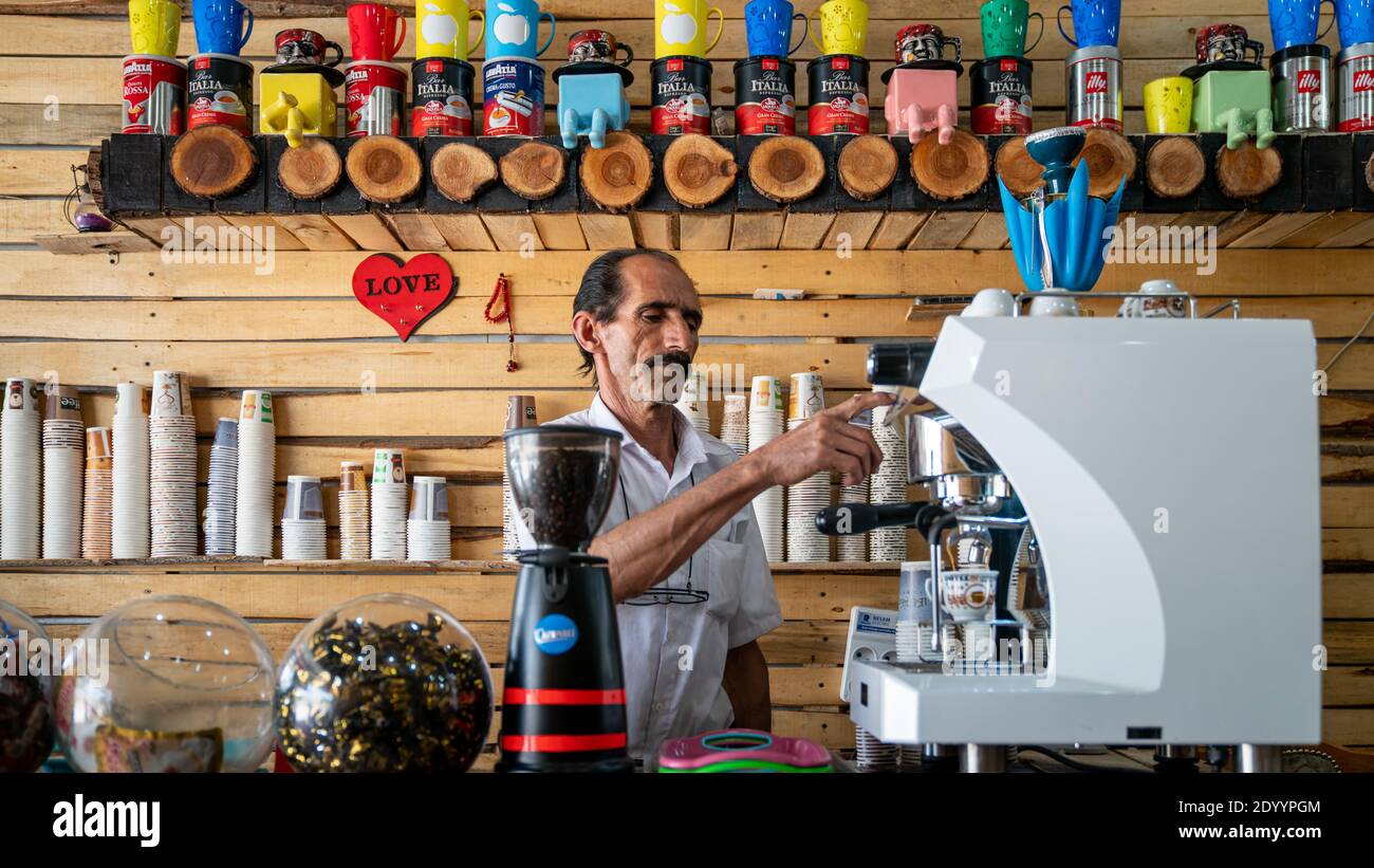 Isfahan, Iran - May 2019: Iranian man making coffee with a coffee ...