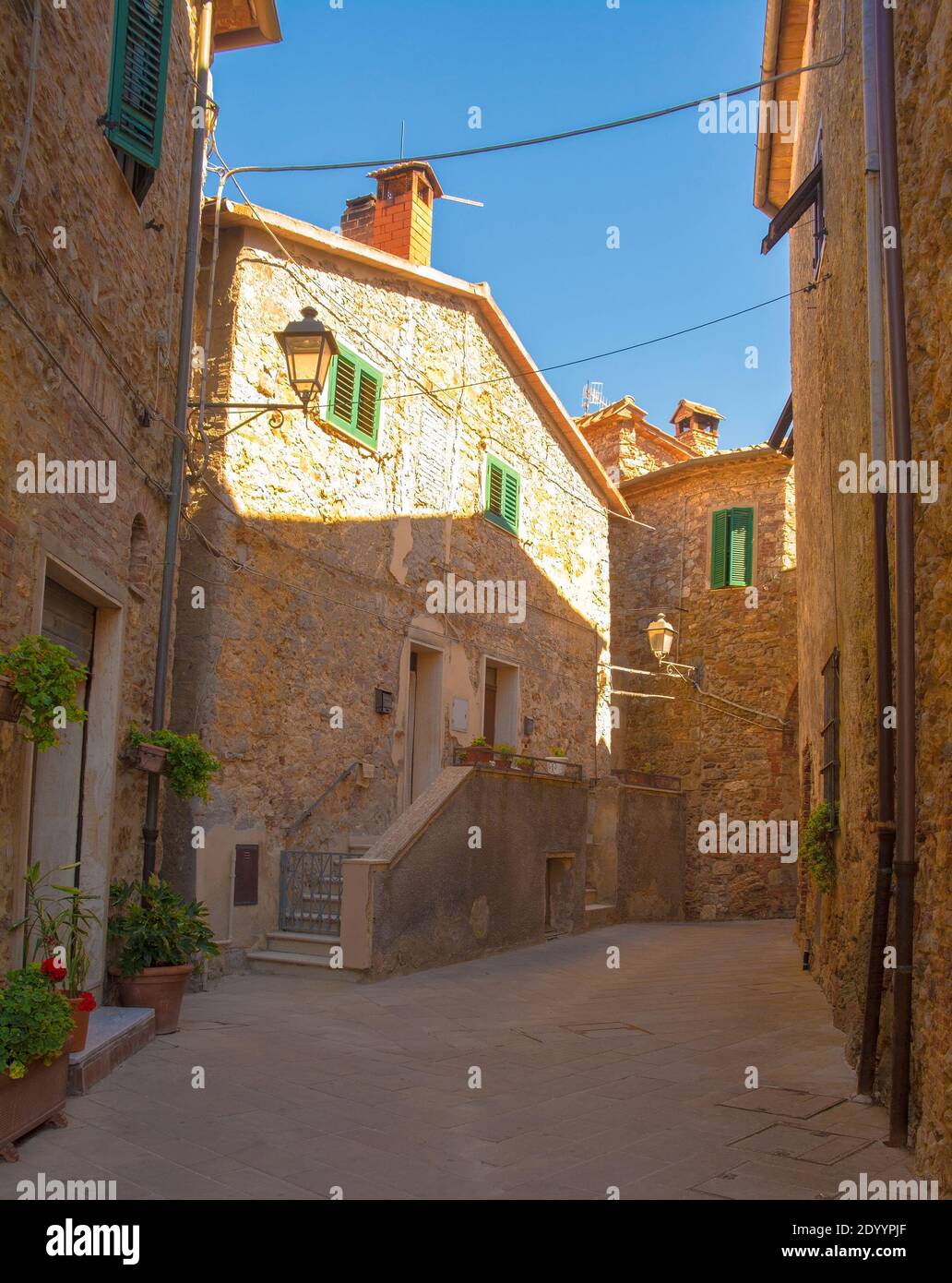 A street of historic stone buildings in the village of Montorsaio in ...