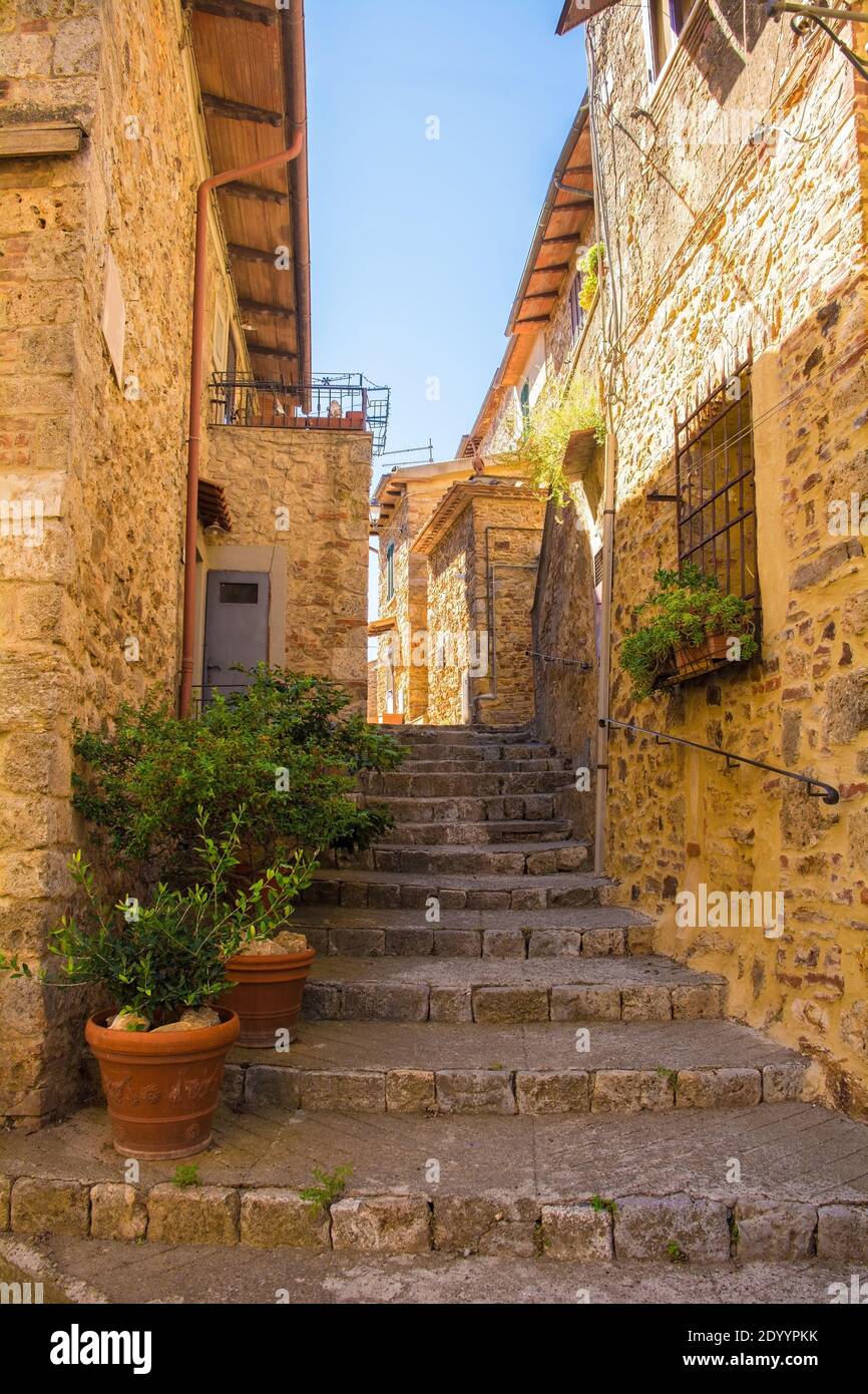 A street of historic stone buildings in the village of Montorsaio in ...