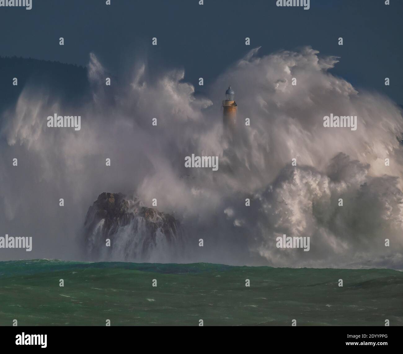 The Mouro island lighthouse during a storm. Big waves, more of 10 ...