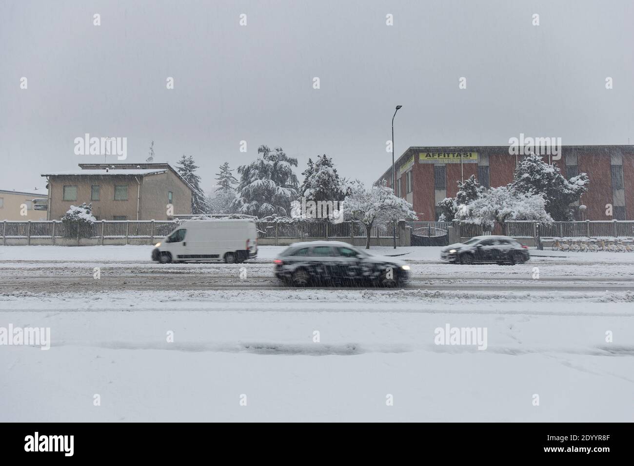 Milan, Italy - December 28, 2020: street view of Milan during the snow ...