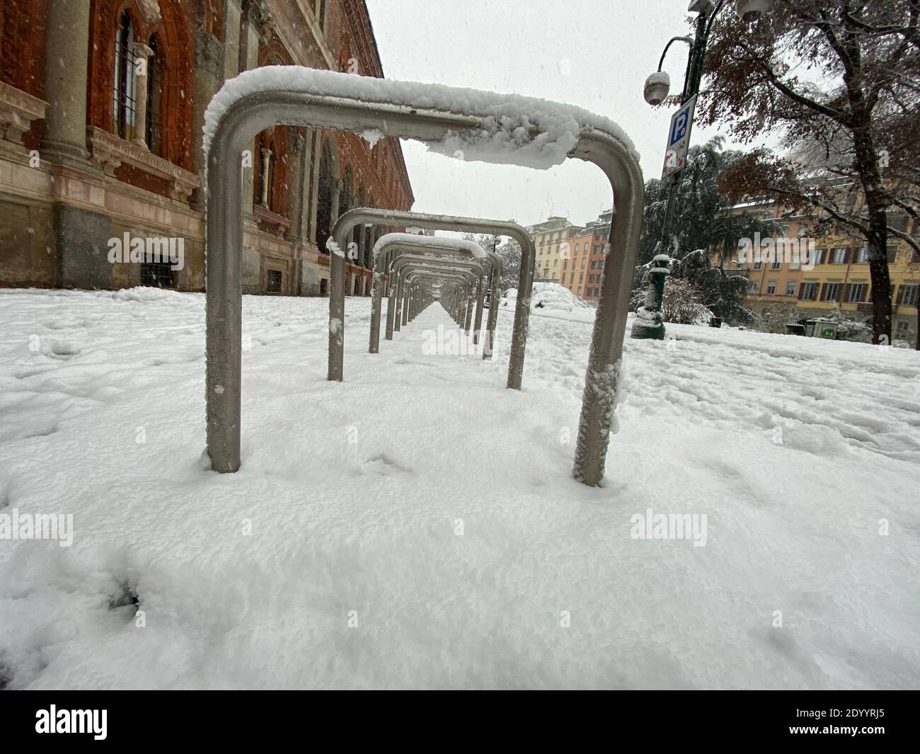 Milan, Italy - December 28, 2020: street view of Milan during the snow ...