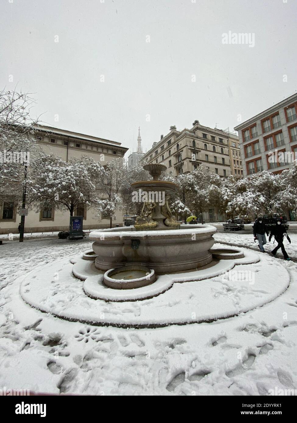Milan, Italy - December 28, 2020: street view of Milan during the snow ...