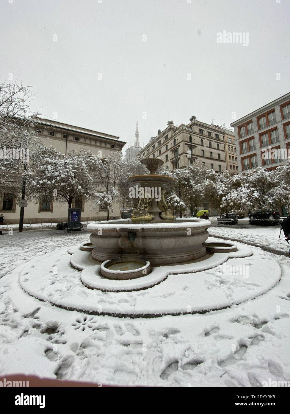 Milan, Italy - December 28, 2020: street view of Milan during the snow ...