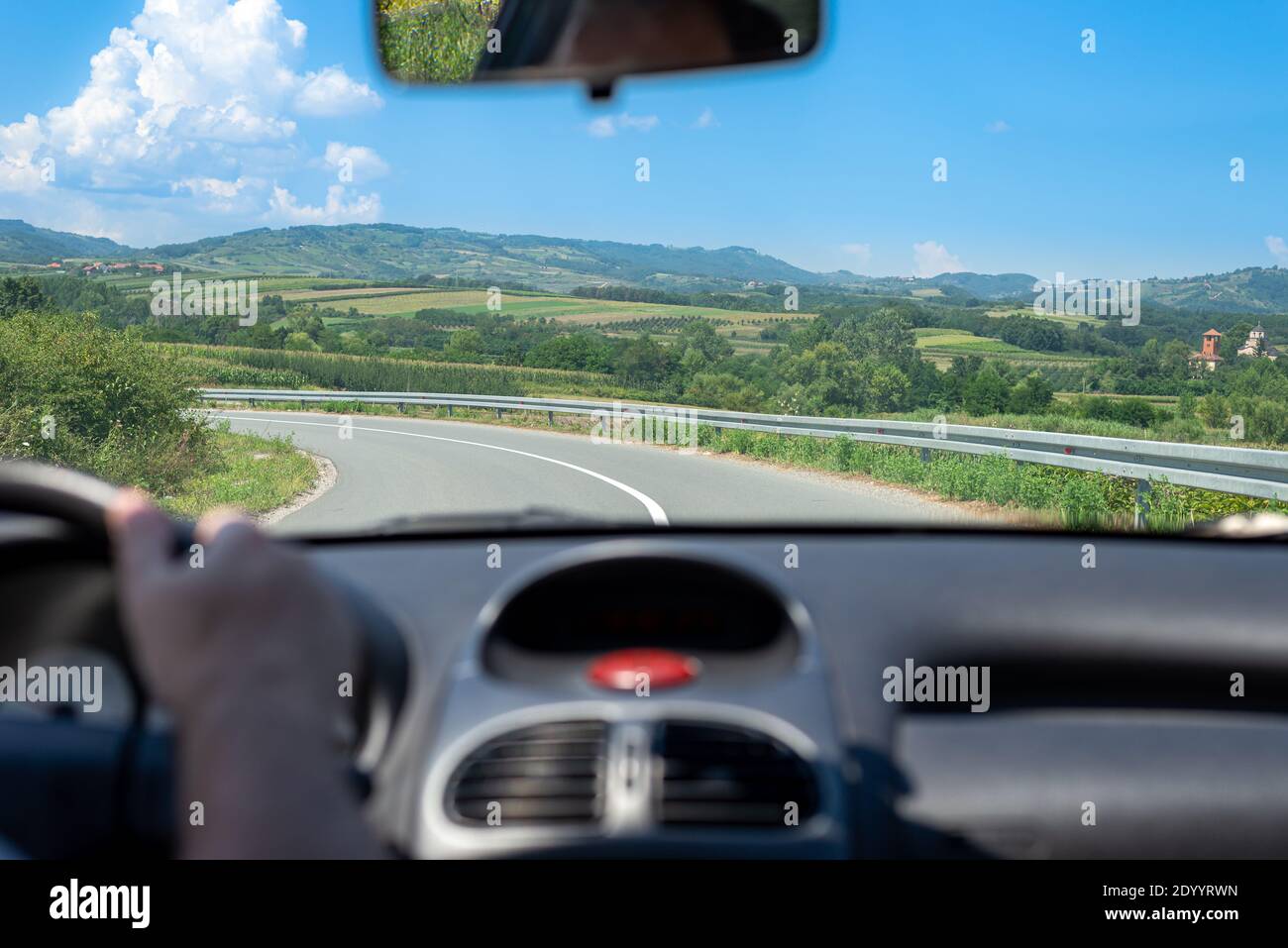 Driving on a road through an idyllic countryside in Serbia Stock Photo ...