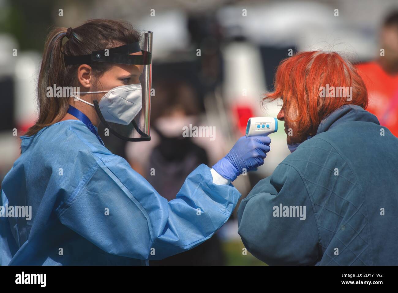 Doctor checking temperature hi-res stock photography and images - Alamy