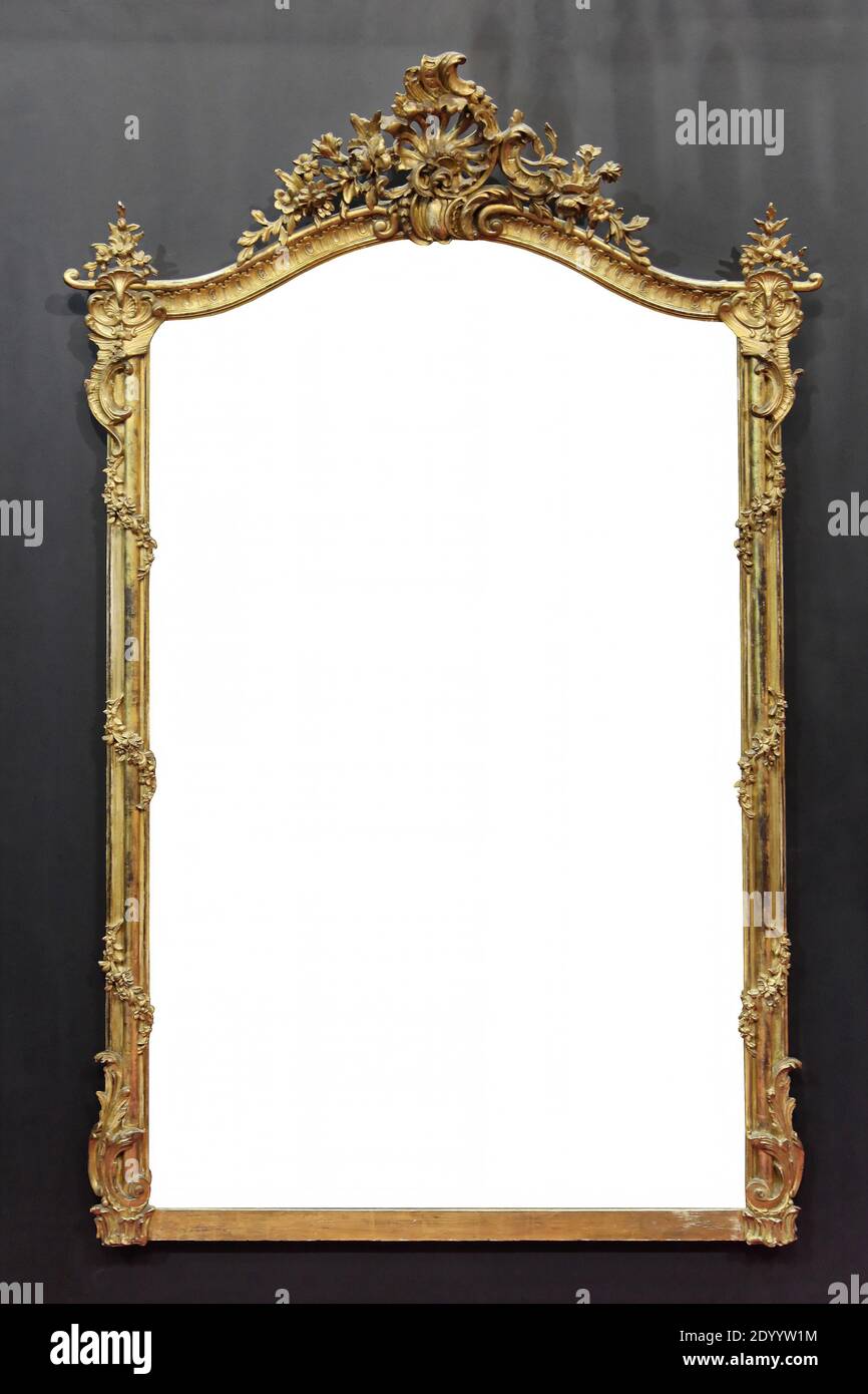 Antique Style Gold Mirror Frame at Black Wall Stock Photo - Alamy