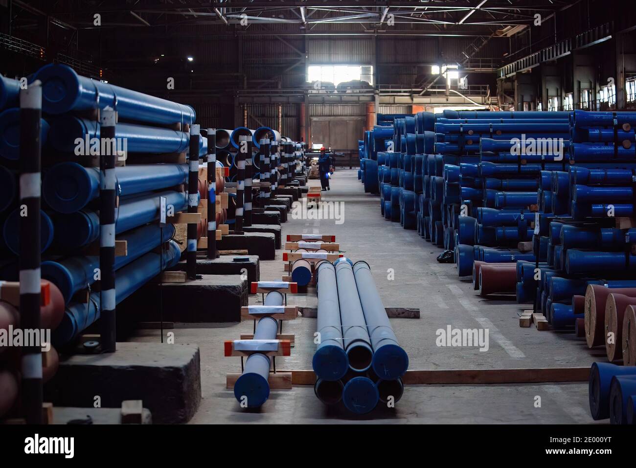 New cast iron pipes for pipeline construction in warehouse Stock Photo ...