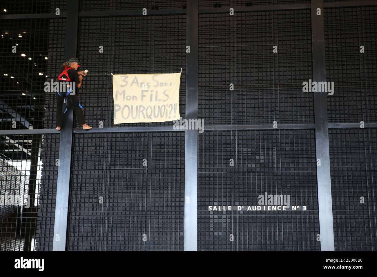 Serge Charnay stands on a wall inside the court house in Nantes, France ...