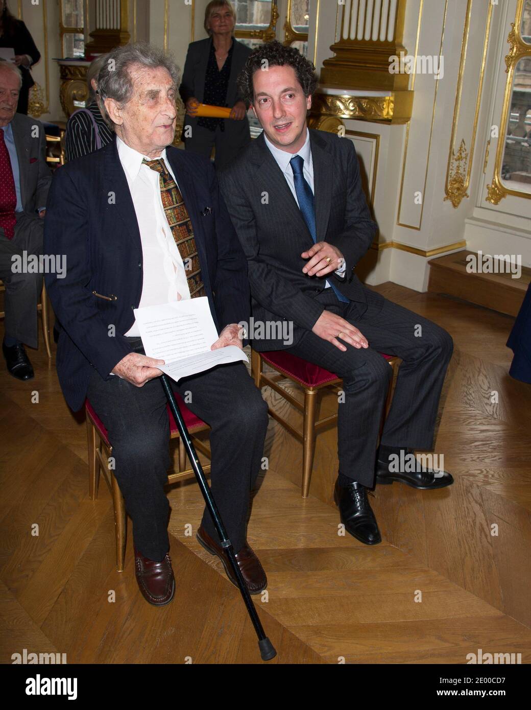 Jean Lacouture and Guillaume Gallienne pose for pictures after a ...