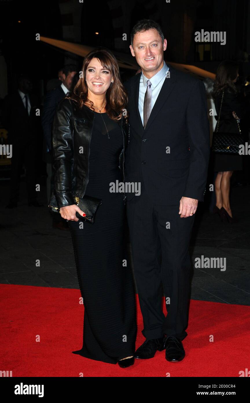 Screenwriter Jeff Pope and guest arriving for the premiere of the film ...