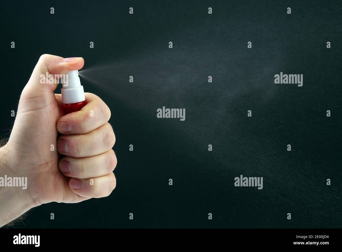 spray gun with liquid sprinkles in hand Stock Photo - Alamy