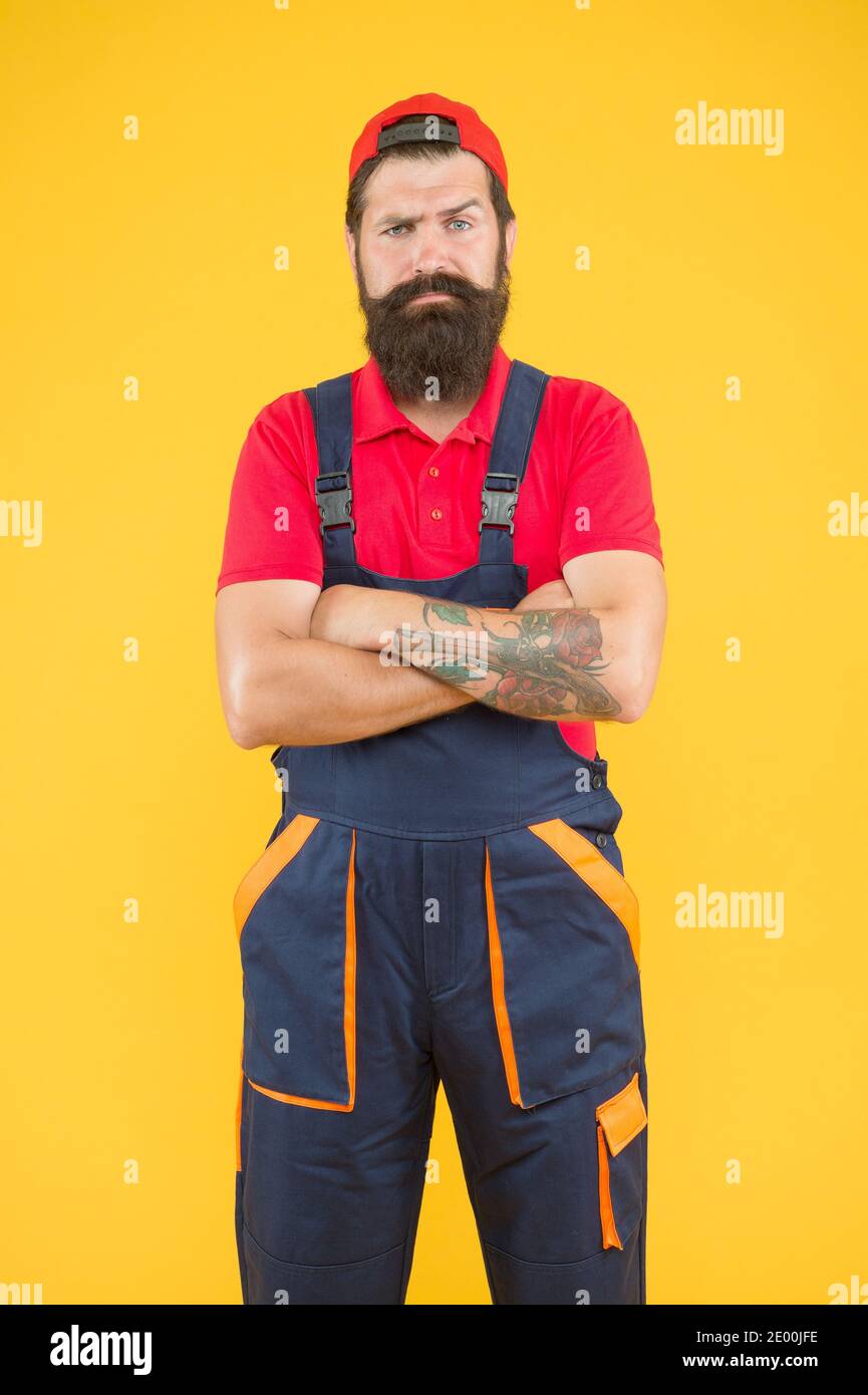 Industry. working on construction site. bearded male handyman. serious ...