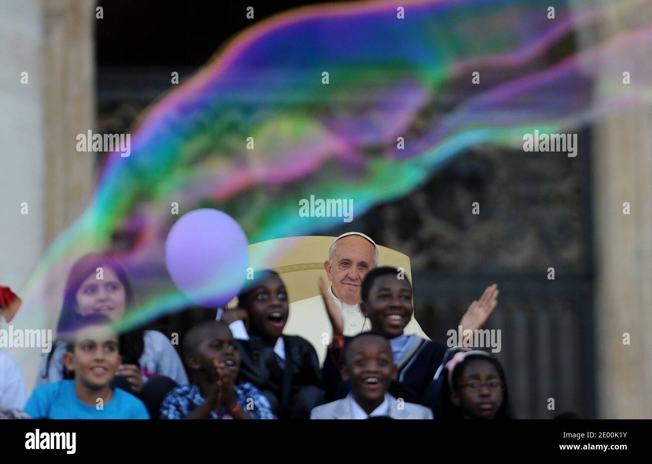 An artist blows a soap bubble Pope Francis leads a meeting with ...