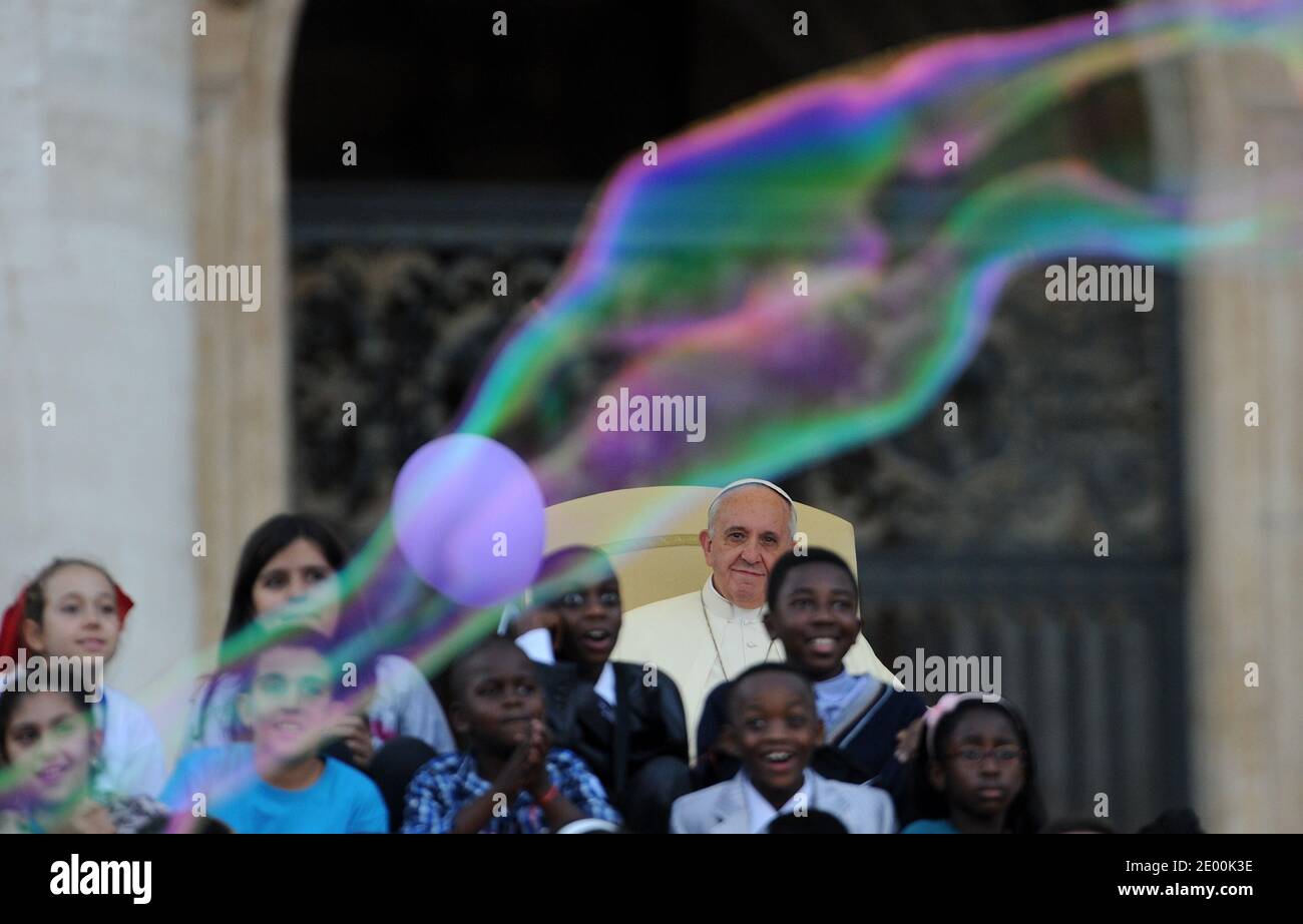 An artist blows a soap bubble Pope Francis leads a meeting with ...