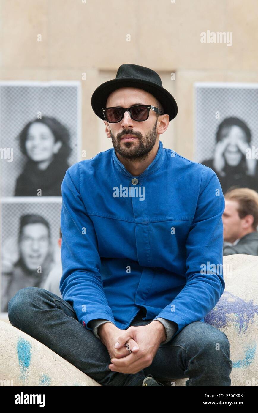 French artist JR poses in front of his public art installation at the ...
