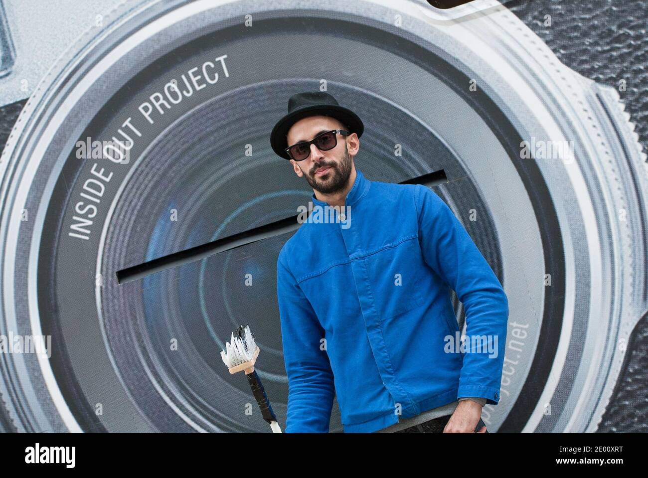 French artist JR poses in front of his photo-studio-truck at the Palais ...