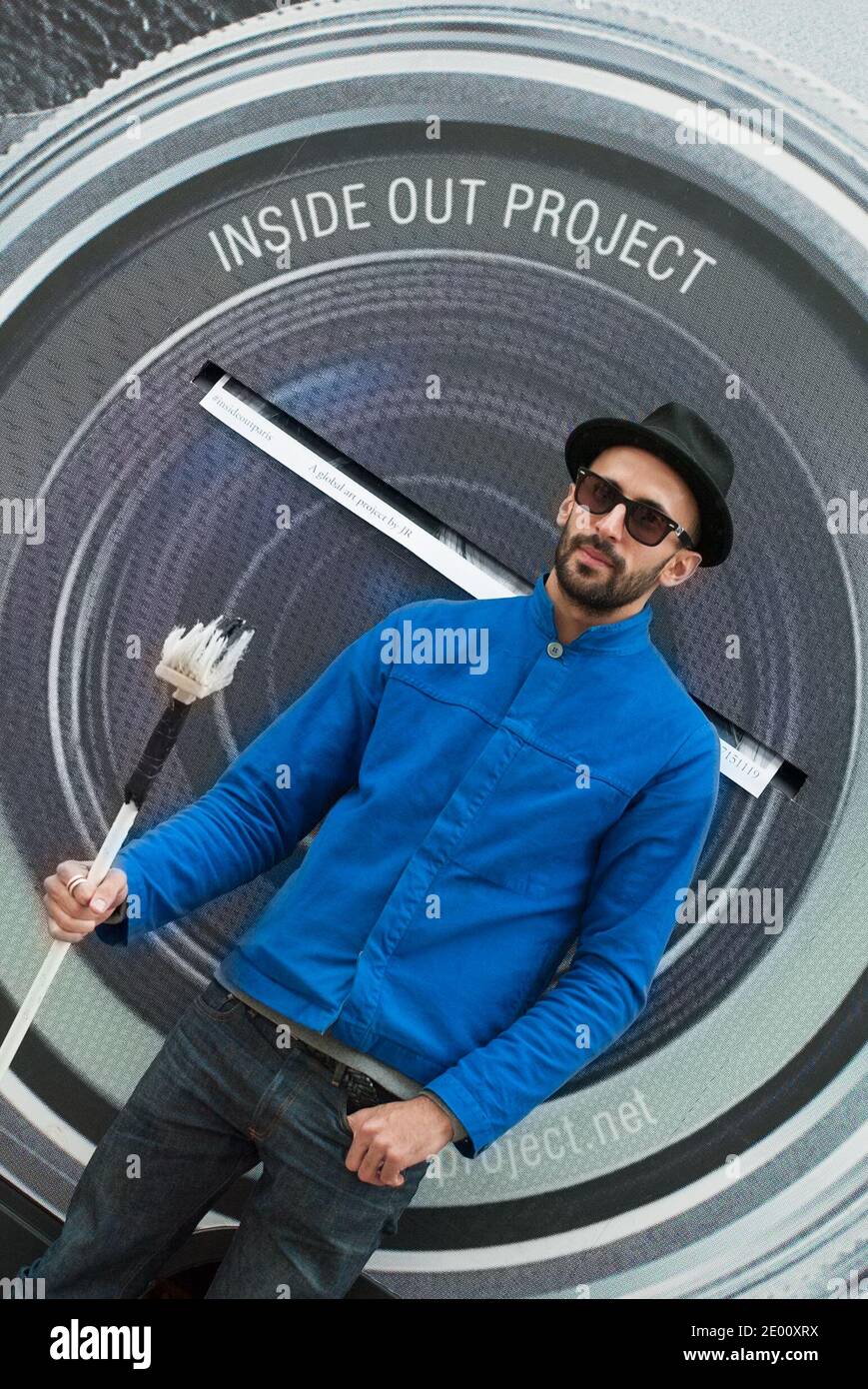French artist JR poses in front of his photo-studio-truck at the Palais ...