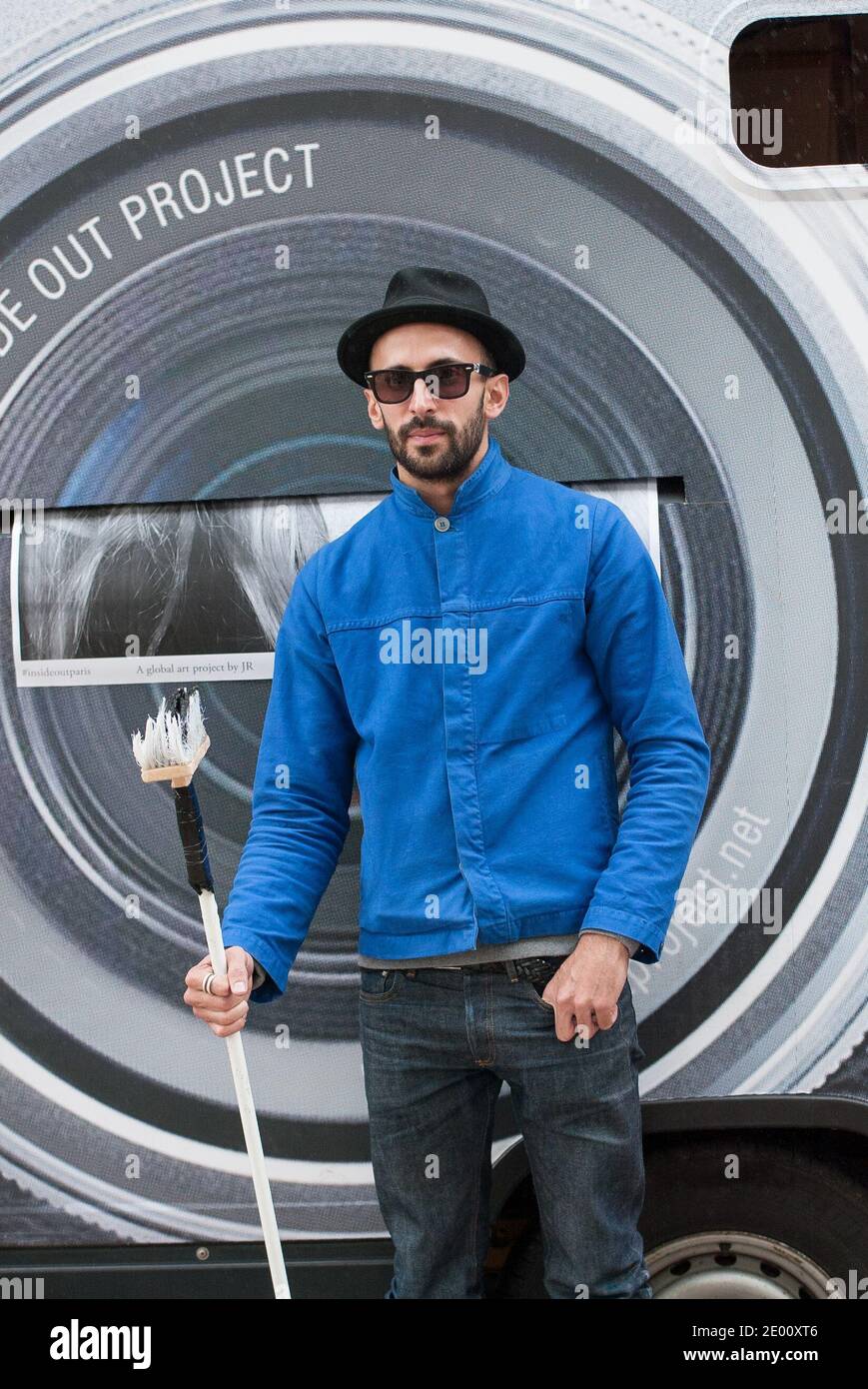 French artist JR poses in front of his photo-studio-truck at the Palais ...