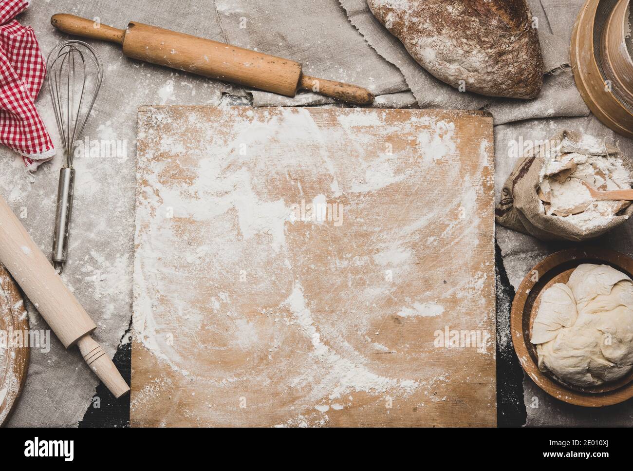 baked bread, white wheat flour, wooden rolling pin and old cutting ...