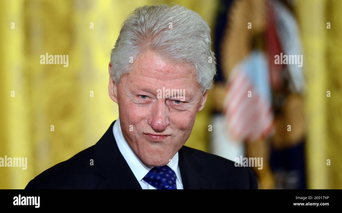 Former U.S. President Bill Clinton looks on before receiving the awards ...