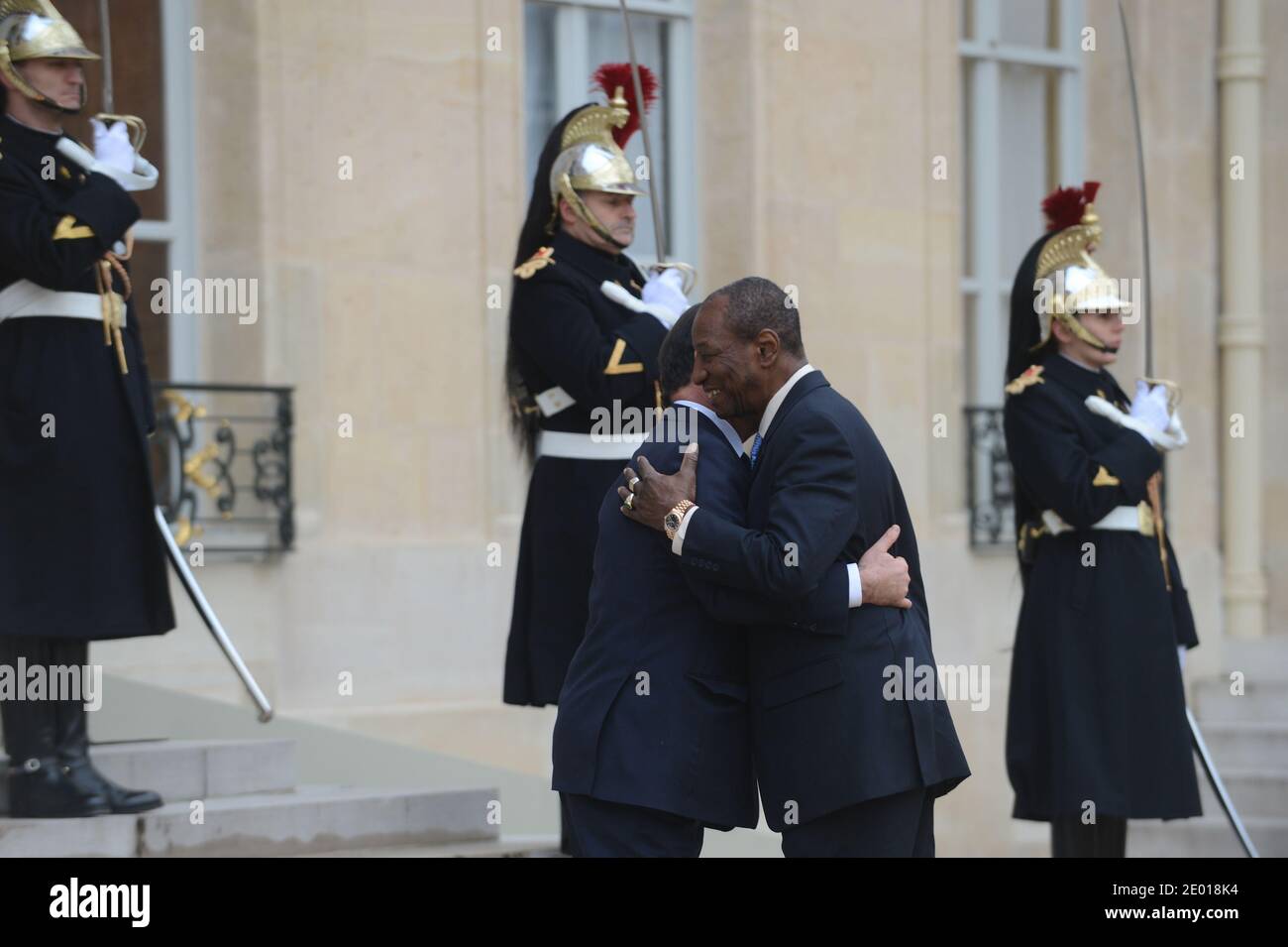 French President Francois Hollande (left) welcomes his Guinean ...
